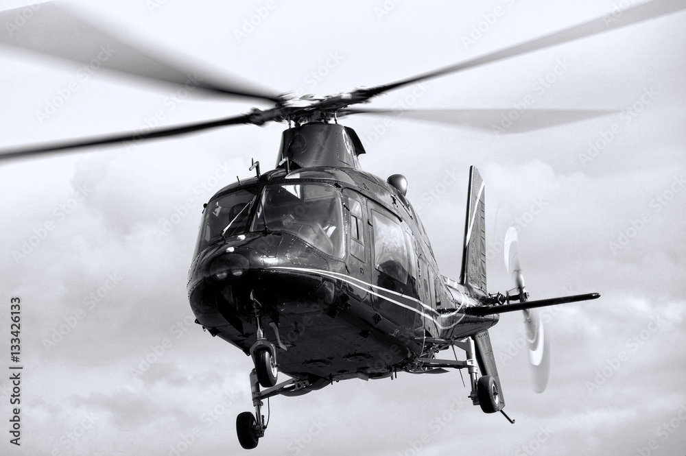 Black and white image of a helicopter hovering in flight Stock Photo ...