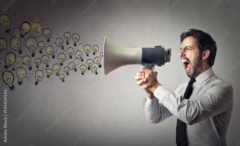 Talking out ideas trough megaphone Stock Photo | Adobe Stock
