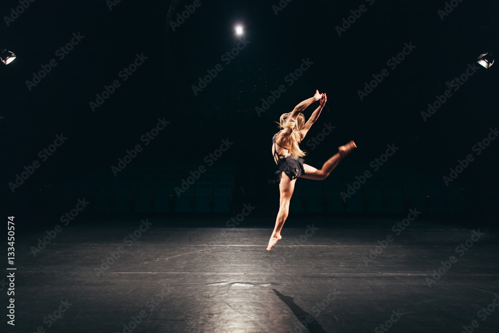 woman alone on stage doing modern dance performance Stock Photo | Adobe ...