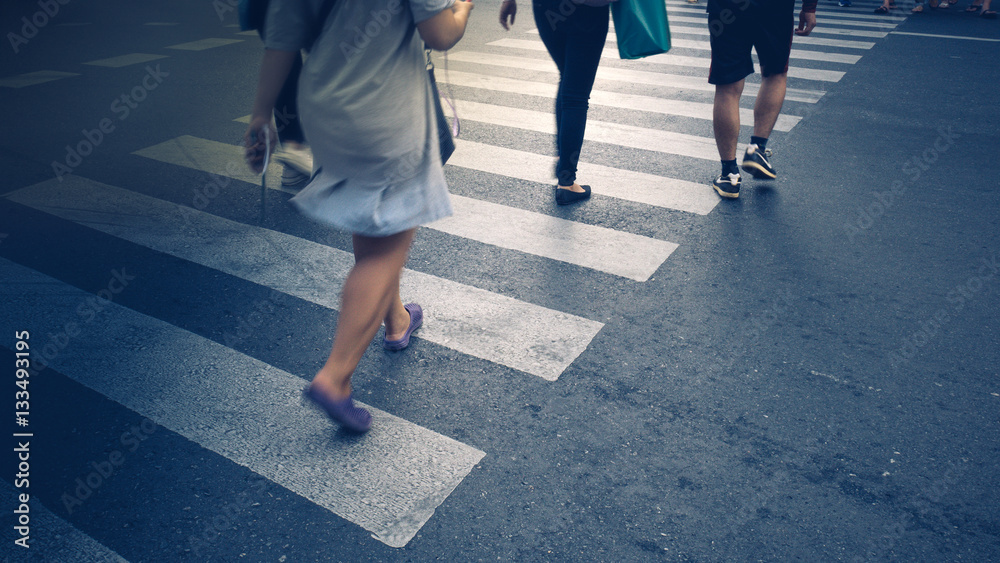 Motion of pedestrian zebra crossing or crosswalk in asia. Feet of the ...