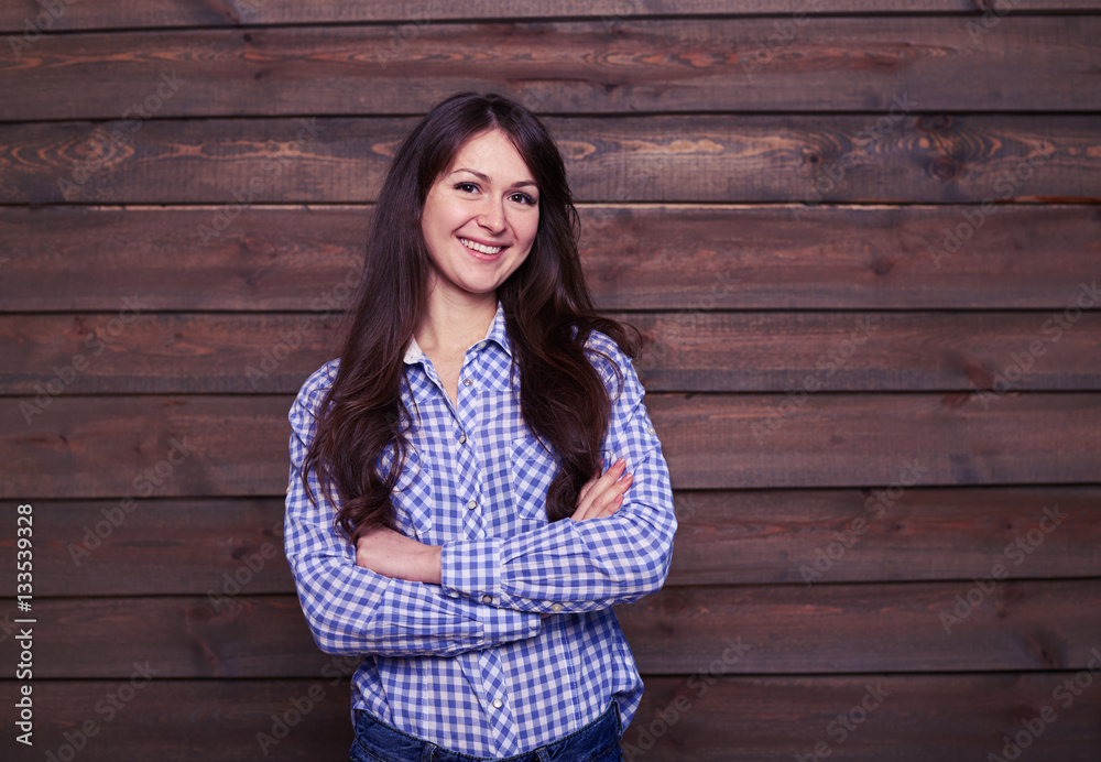 Delightful look of confident girl with folded arms posing agains Stock ...