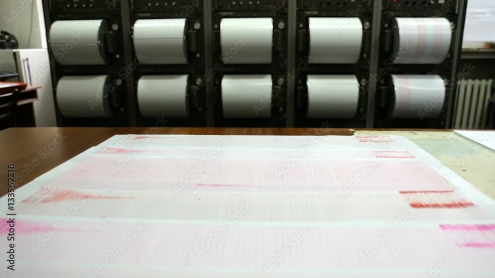 Seismograph records an earthquake on the sheet of measuring paper ...