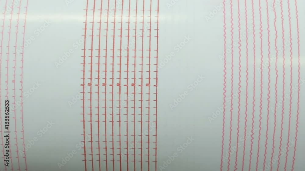 Seismograph records an earthquake on the sheet of measuring paper ...
