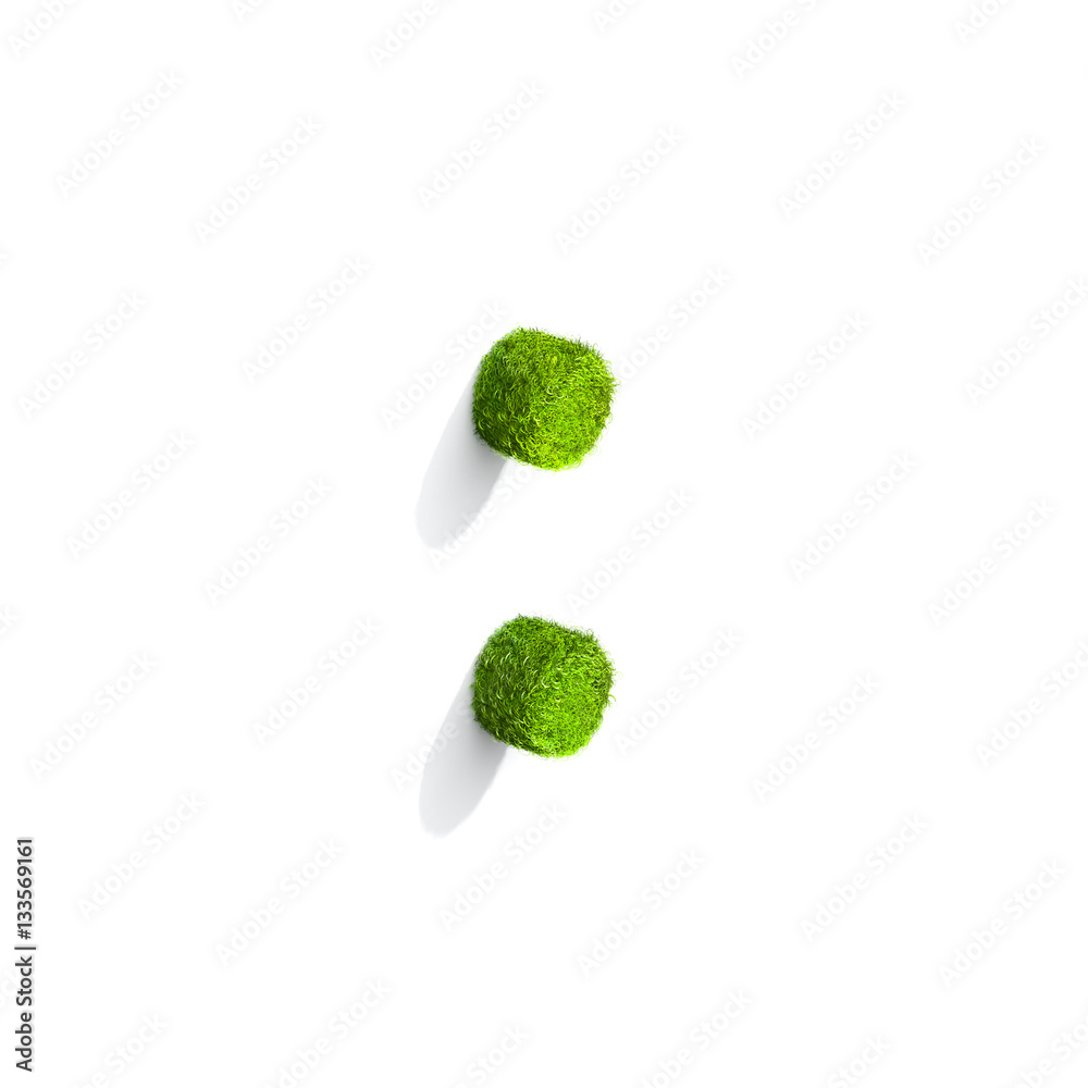 Grass colon punctuation mark from isometric angle with shadow on ground ...