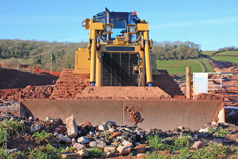 Bulldozer on a construction site foto de Stock | Adobe Stock