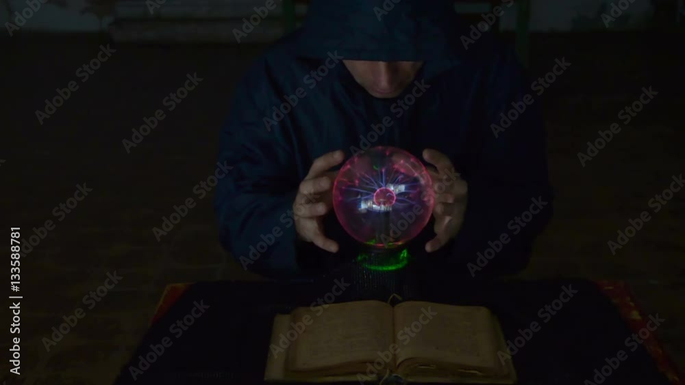 Evil wizard casts a spell with the magic ball Stock Video | Adobe Stock
