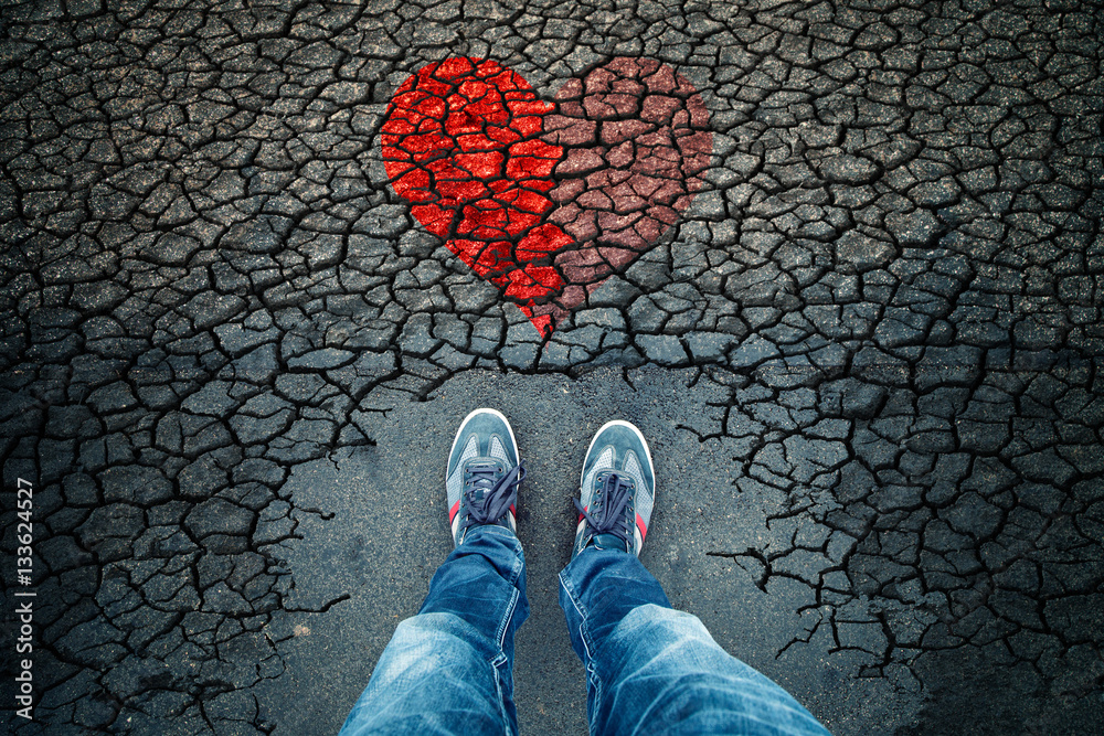 Sad man standing alone on cracked asphalt floor with illustrated ...