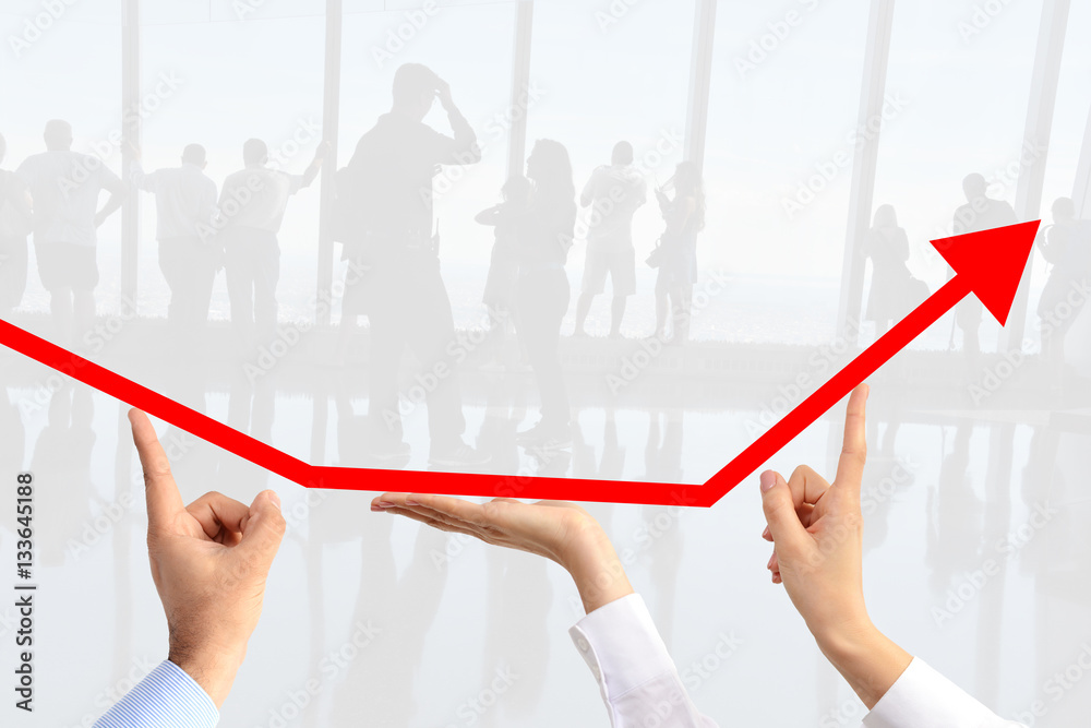 Business people’s hands guiding an arrow graph chart to go upwards ...