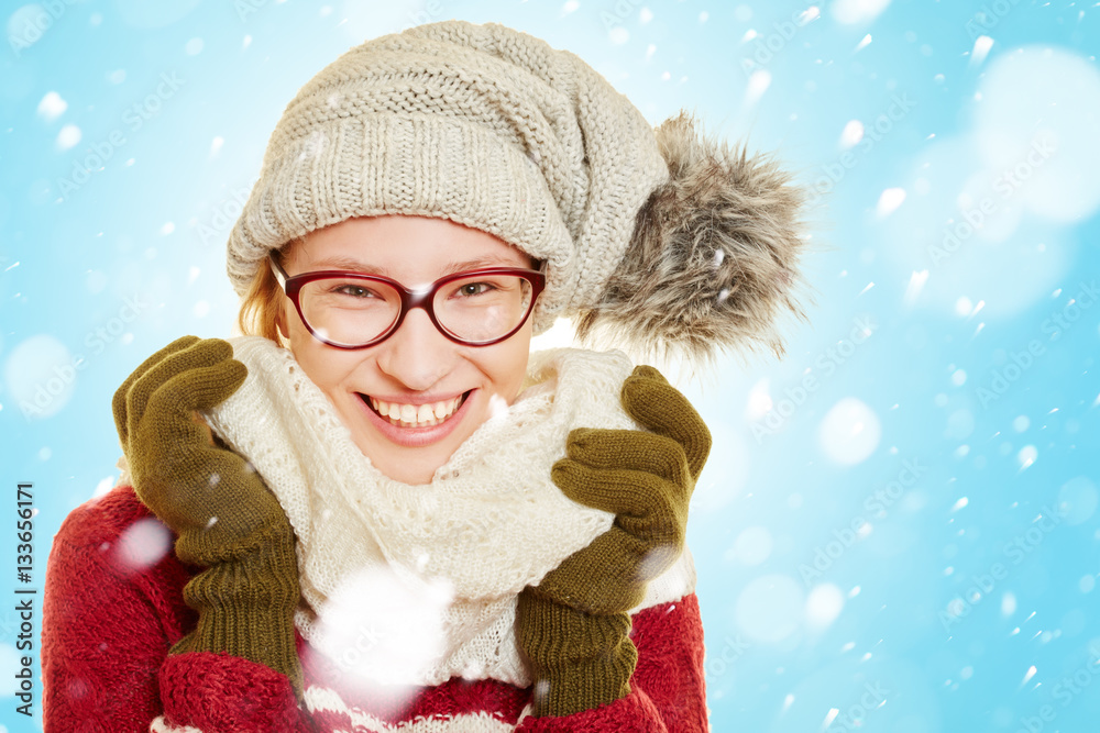 Smiling woman in the snow in winter Stock Photo | Adobe Stock