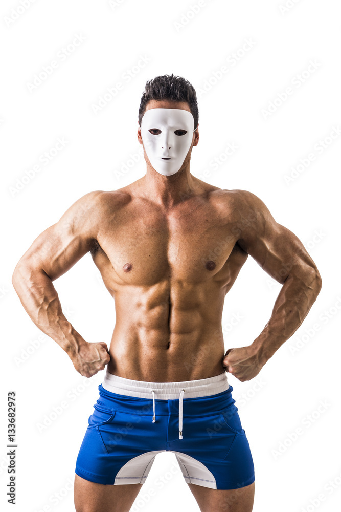 Shirtless muscle man with creepy, scary mask on tilted head, isolated ...