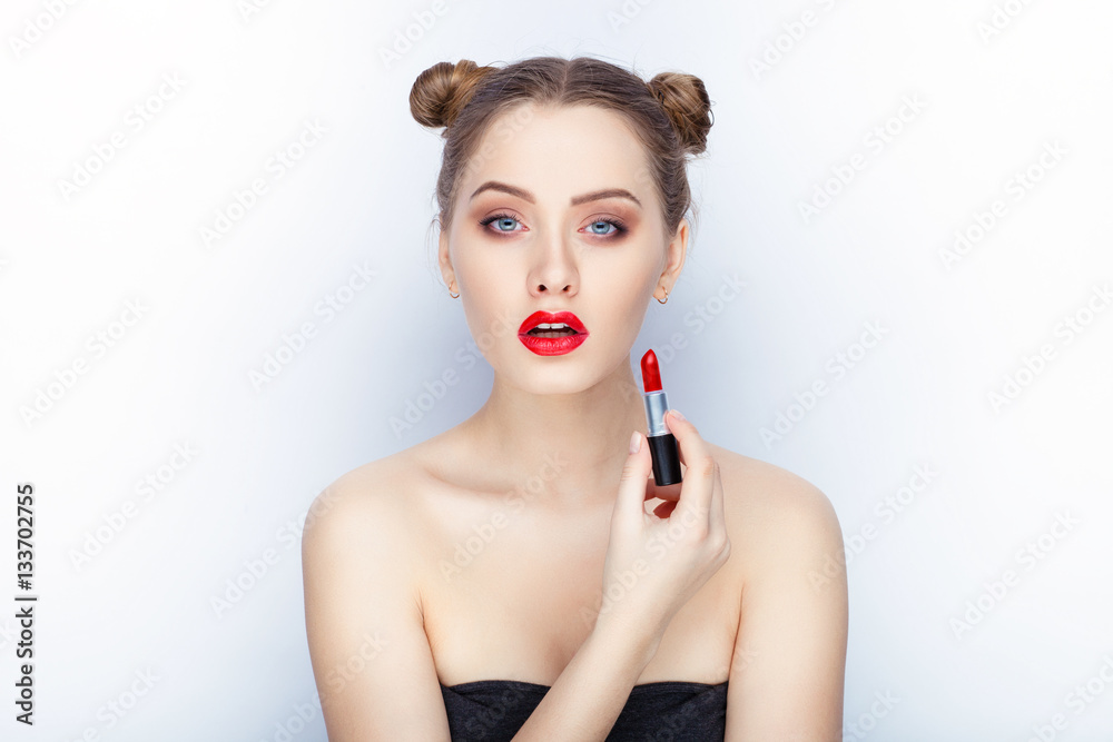 Young pretty woman trendy makeup bright red lips bun hairstyle bare ...