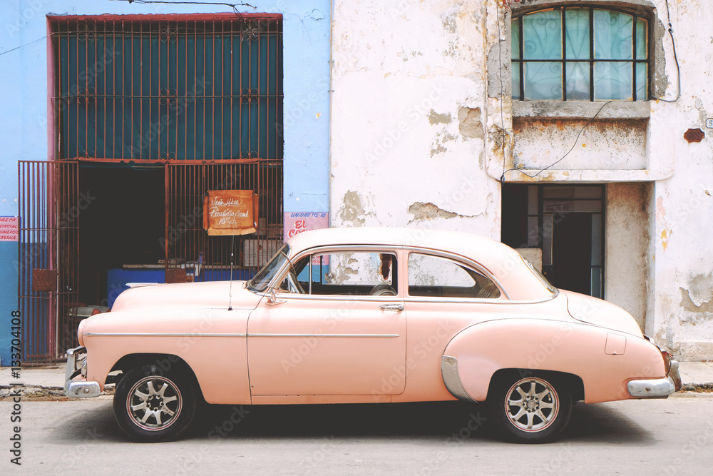 Side view of pink vintage car parked on street Stock Photo | Adobe Stock