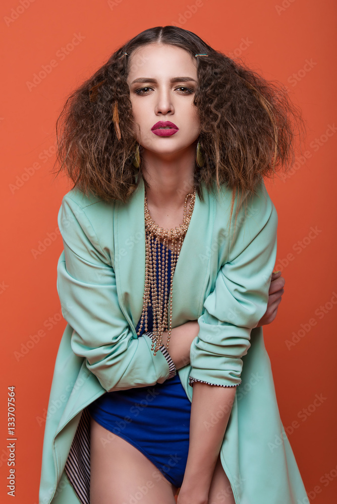 Fashion photo of beautiful girl in studio. Young brunette woman in blue ...