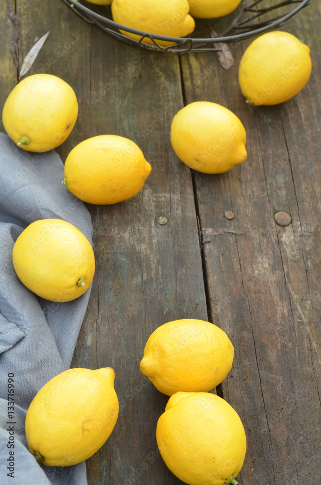 still life of fresh lemons on rustic wood tabletop Stock Photo | Adobe ...