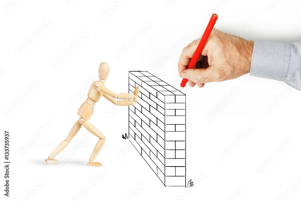 Man draws a wall and makes obstacles for other person. Conceptual image ...