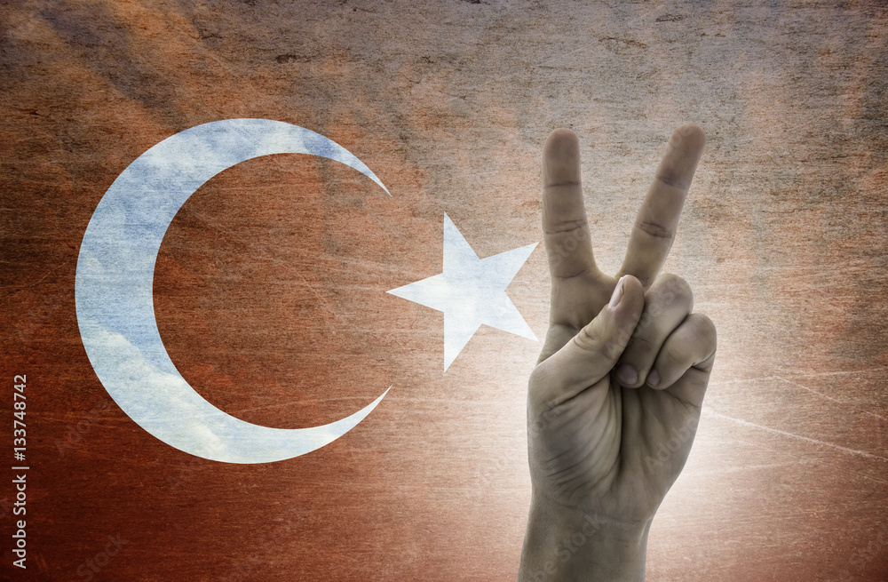 Victory symbol - two fingers against background of Turkey flag Stock ...