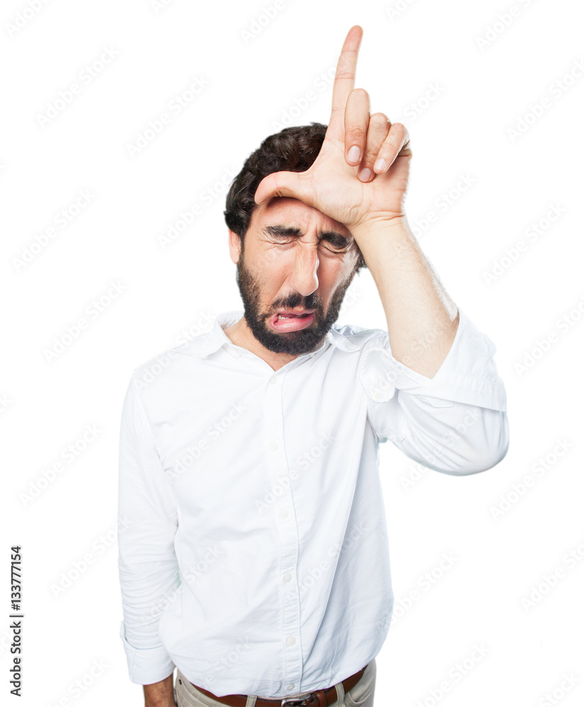 young funny man loser sign. sad expression foto de Stock | Adobe Stock