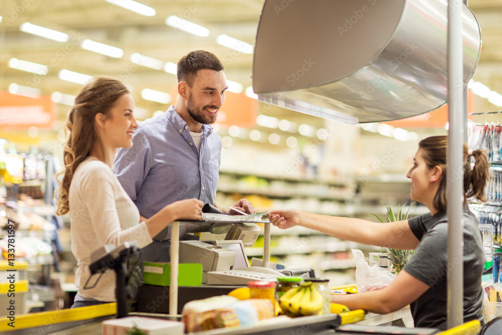 couple buying food at grocery store cash register Stock Photo | Adobe Stock