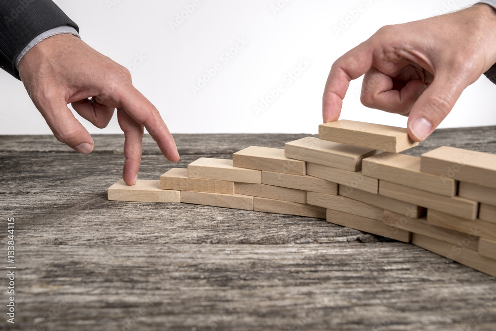 Businesspeople building blocks into upward trend Stock Photo | Adobe Stock