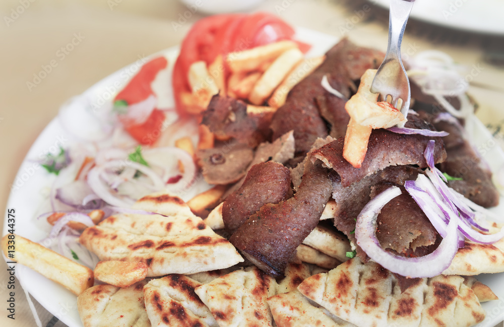 Turkish doner, Greek gyros, meat, fried potatoes, tomatoes and onions ...