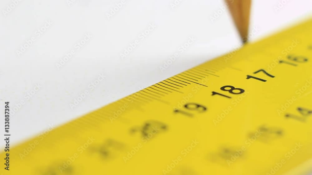 Using a ruler and a pen to draw on white paper. Stock Video | Adobe Stock
