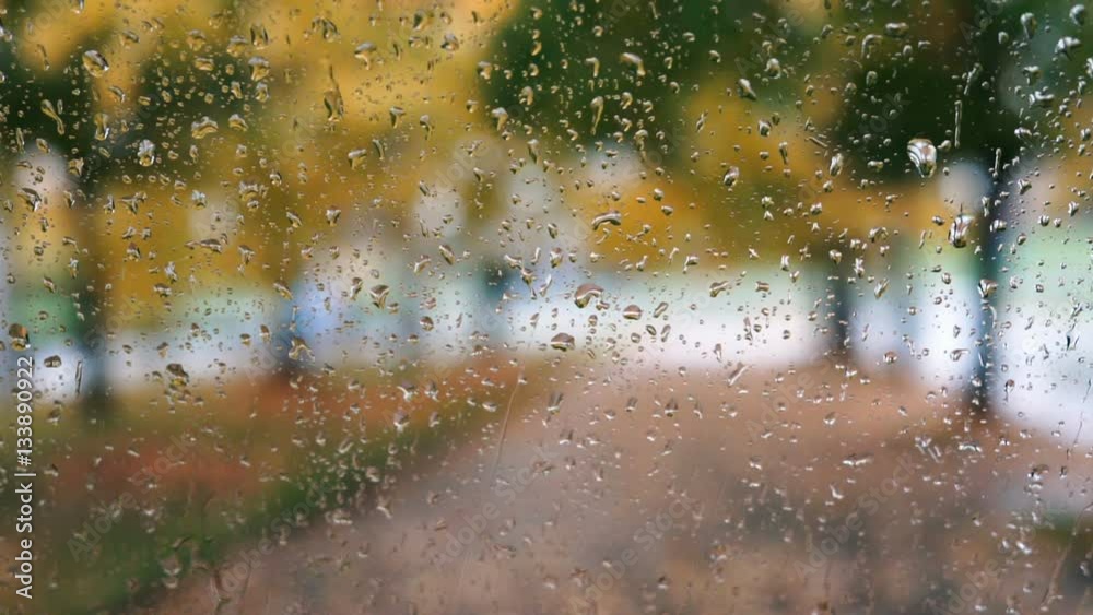 Texture windshield of the car window covered with rain drops falling on ...