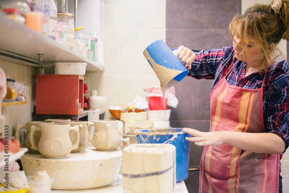 Pouring clay in mold Stock Photo | Adobe Stock