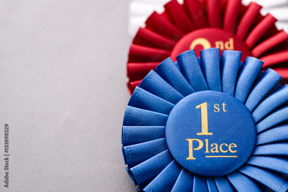 Blue and red 1st and 2nd place winners rosettes Stock Photo | Adobe Stock