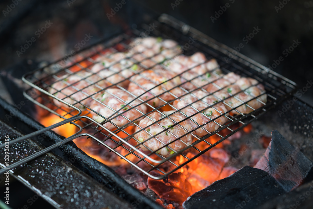 Barbecue meat on coal fire. The ingredient of "bun cha" is the famous ...