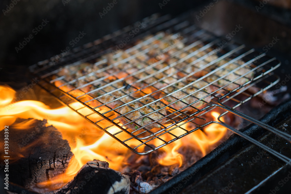 Barbecue meat on coal fire. The ingredient of "bun cha" is the famous ...