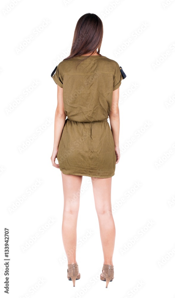 back view of standing young beautiful brunette woman. Stock Photo ...