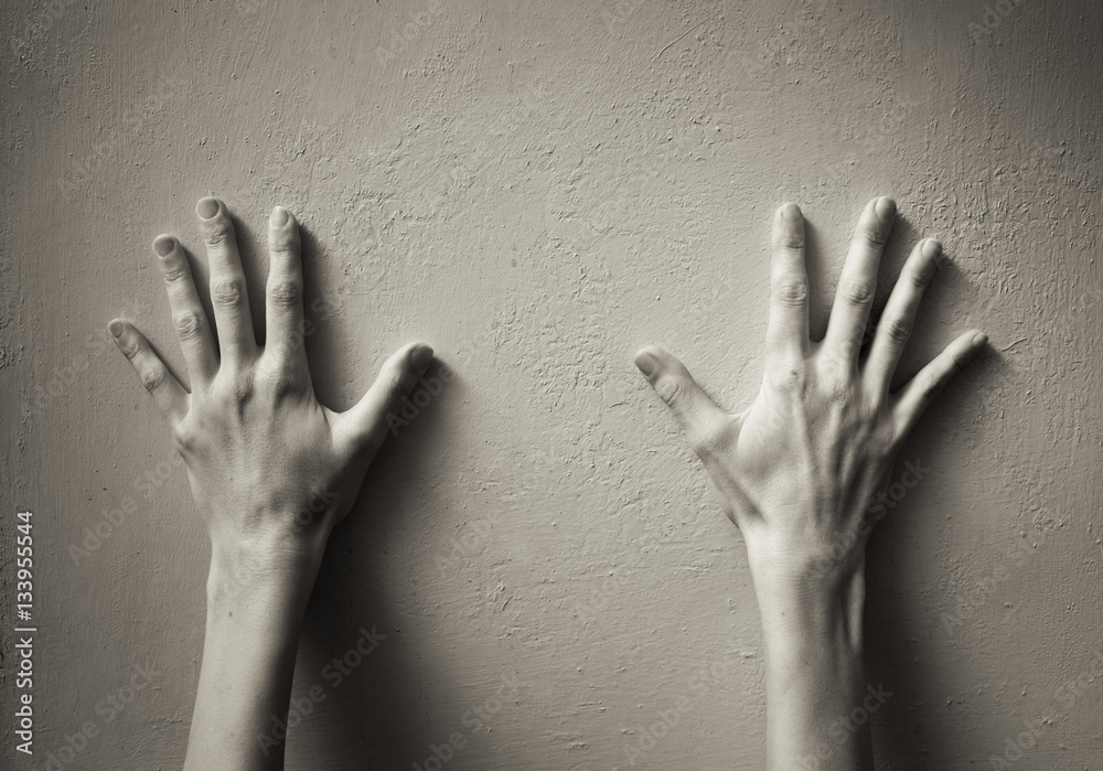 Hands up! Hands against the wall concept. Stock Photo | Adobe Stock
