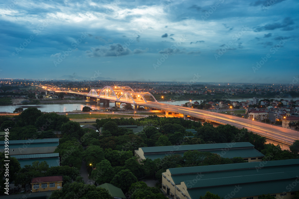 Aerial view of Dong Tru bridge crossing Red River at twilight in Hanoi ...