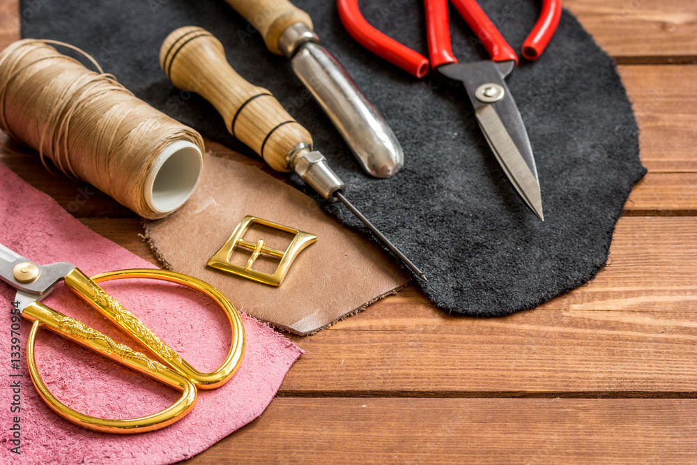 leather craft instruments on wooden background close up Stock Photo ...