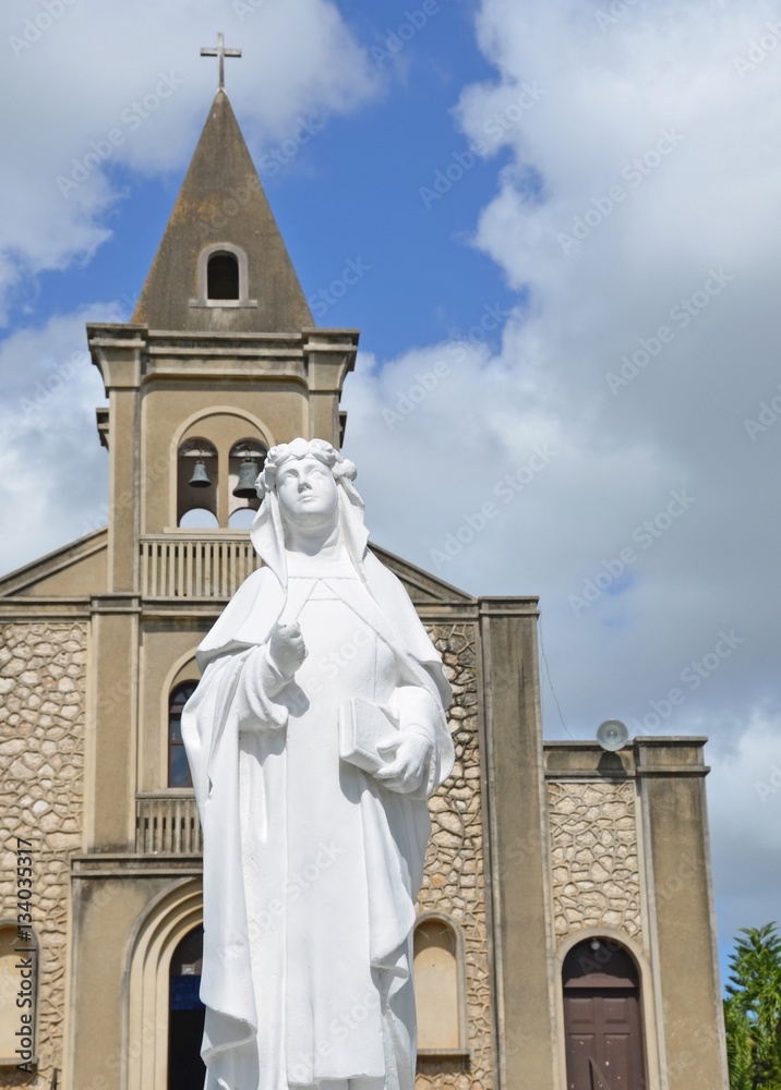 Santa Rosa statue with the Santa Rosa de Lima Cathedral in the ...