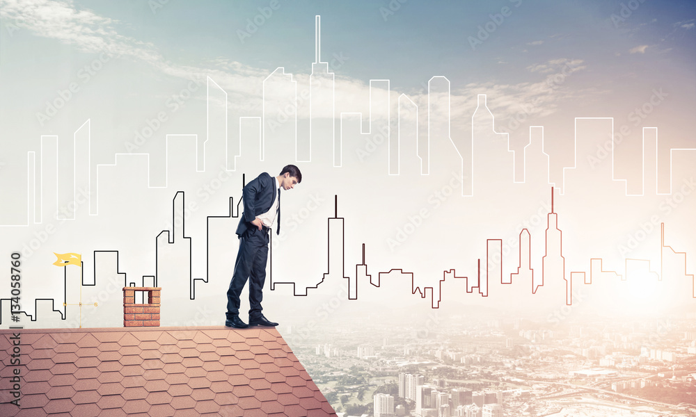 Businessman looking down from roof and modern cityscape at backg Stock ...