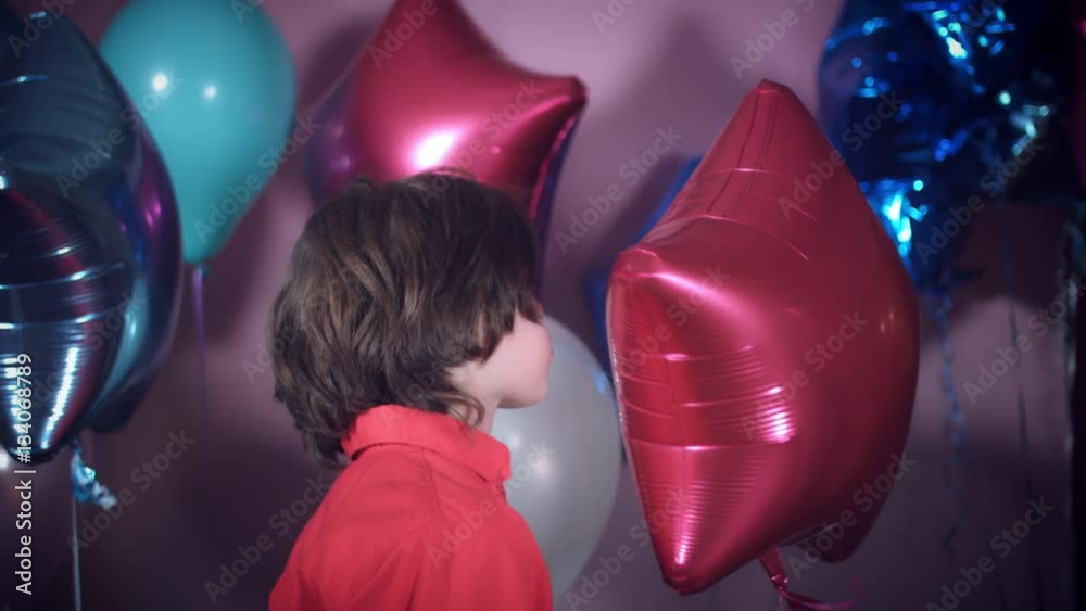 4k Party Birthday Boy Blowing a Helium Balloon Stock Video | Adobe Stock
