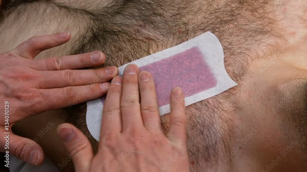 Man getting his chest wax Stock Video | Adobe Stock
