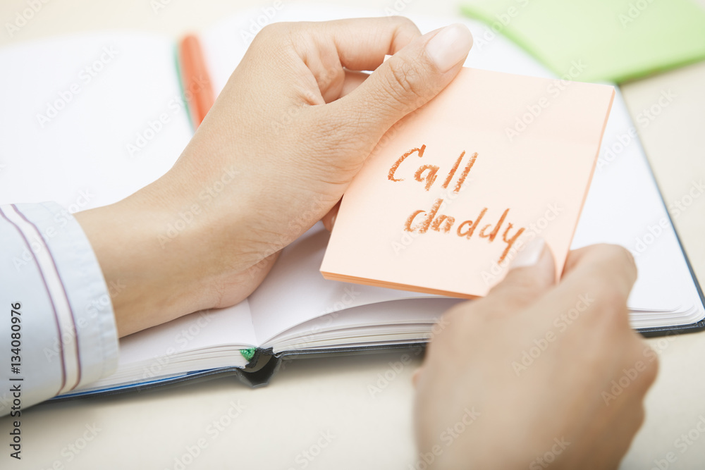 Call daddy text on adhesive note Stock Photo | Adobe Stock