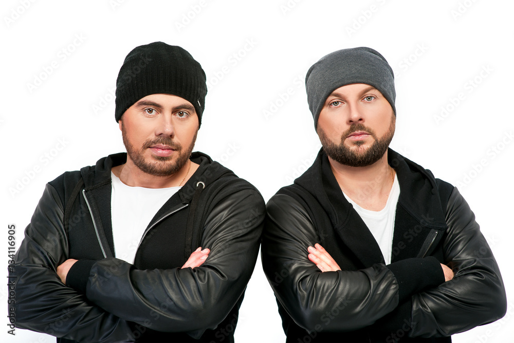 Portrait of two men in black jackets and hats on white background Stock ...