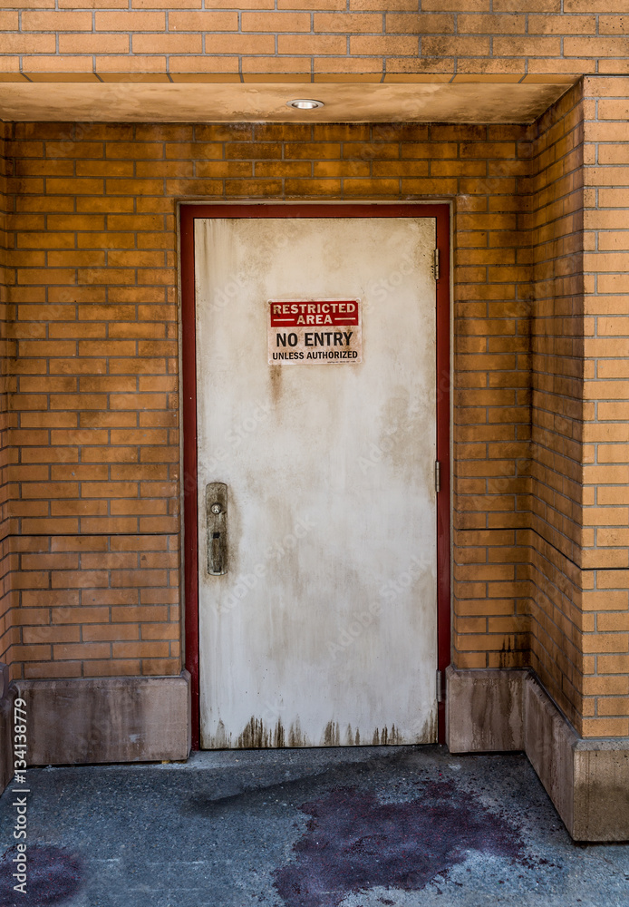 Grunge brick wall and door with no entry sign. Stock Photo | Adobe Stock