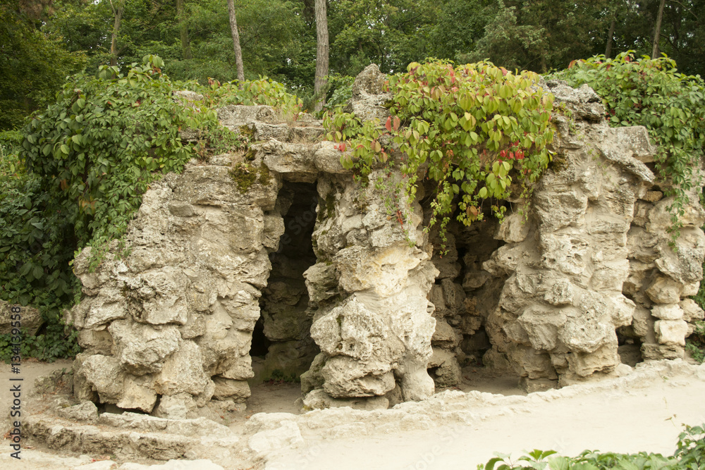 Stone grotto with two entrances twined wild grapes 스톡 사진 | Adobe Stock