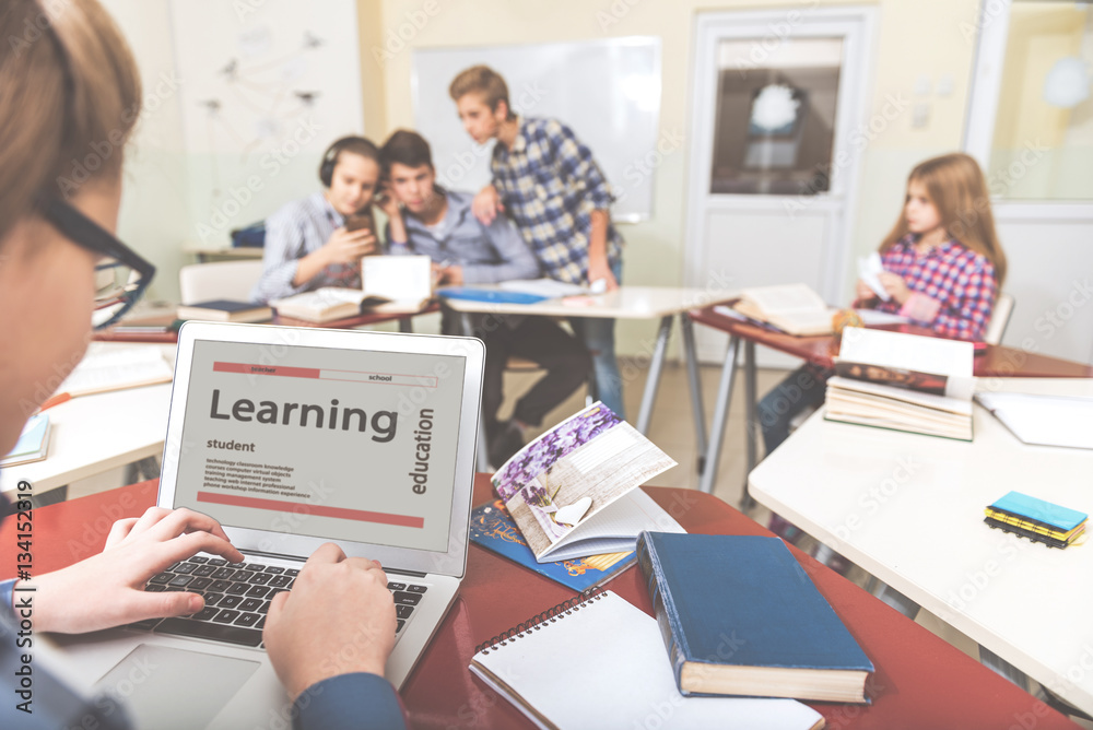 Children using their gadgets in class Stock-Foto | Adobe Stock