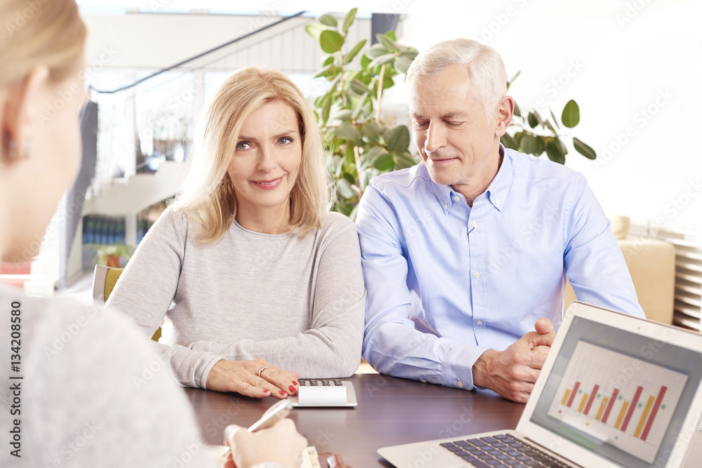 Investment advisor and her senior clients Stock-Foto | Adobe Stock