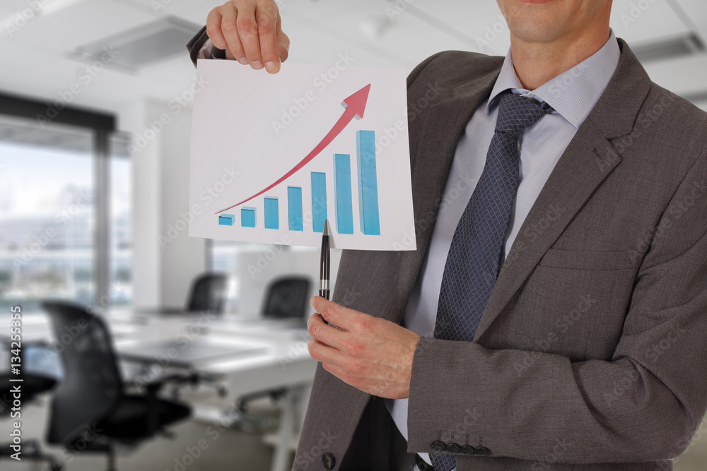 Close up of businessman showing rising arrow, representing business ...