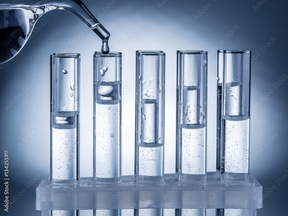 Different laboratory beakers and glassware. Stock Photo | Adobe Stock