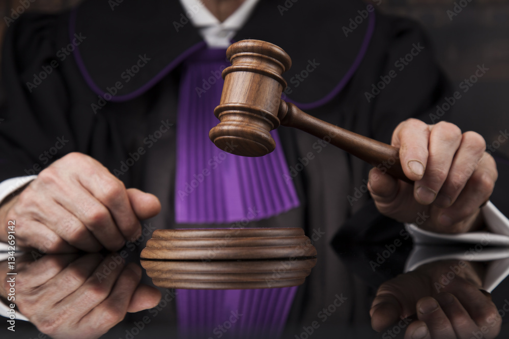 Judge, male judge in a courtroom striking the gavel Stock Photo | Adobe ...