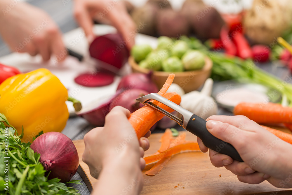 Preparing vegetables for a meal. Stock Photo | Adobe Stock