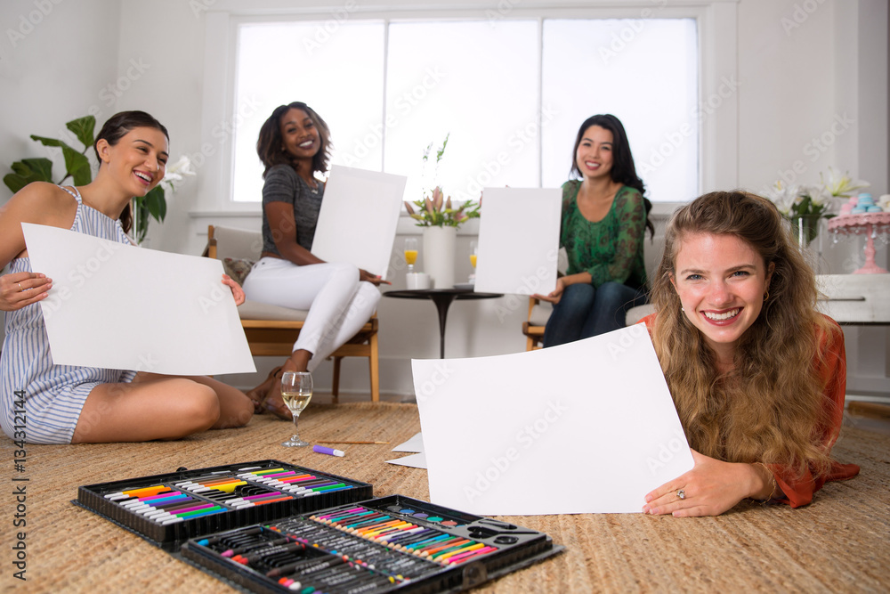 Diverse group of women bonding at house social art craft night together ...