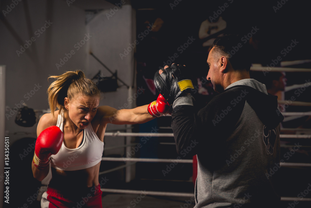 Girl Training on mitts with her boxing instructor foto de Stock | Adobe ...